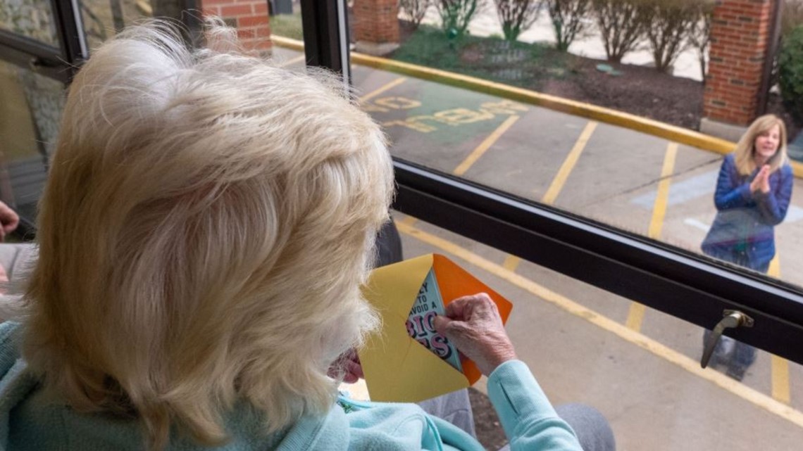 Coronavirus latest: Woman celebrates bday through window | ksdk.com