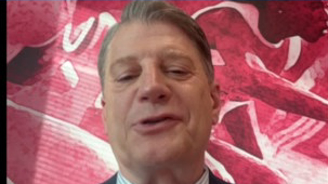 A football team takes to the stands to cheer on the band that supported ...