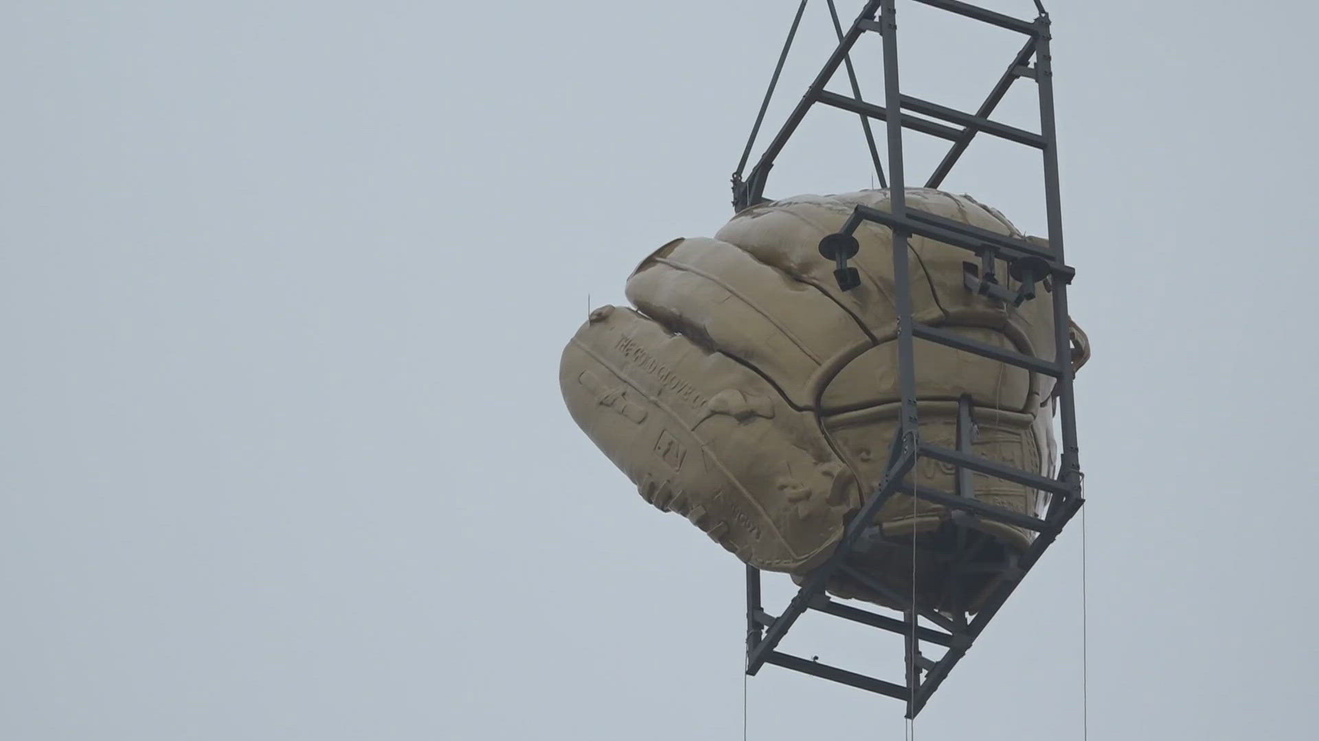 Giant Gold Glove put into place at Westport Plaza | ksdk.com