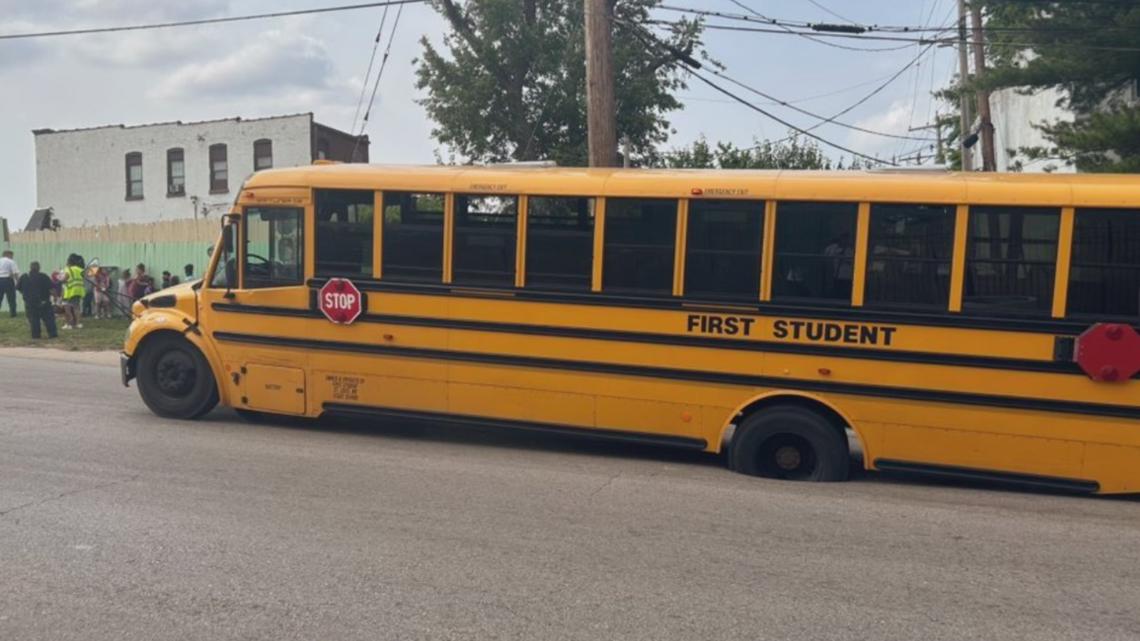 St. Louis' school bus trapped in sinkhole; 12 kids rescued | ksdk.com